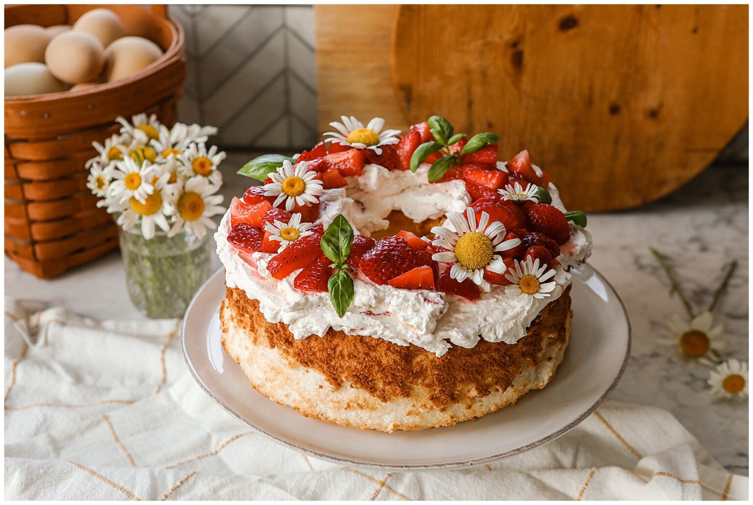 Homemade Angel Food Cake with whipped cream & strawberries